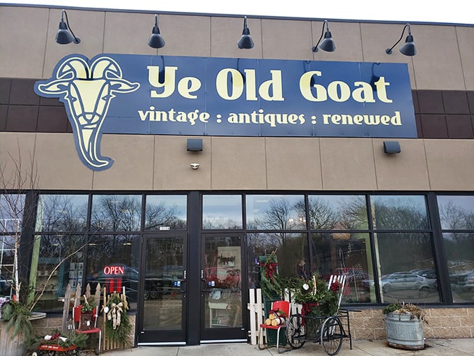The blue storefront of Ye Old Goat beckons like a portal to the past, promising vintage treasures and renewed memories behind those glass doors.