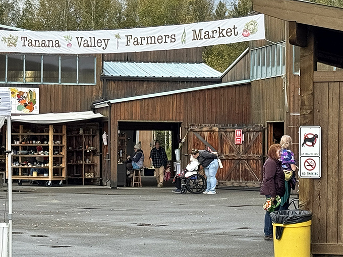 The rustic wooden entrance to Tanana Valley Farmers Market welcomes visitors like a cabin-sized invitation to Alaska's bounty.
