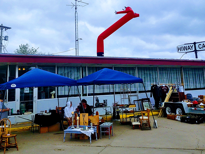 Treasure hunters paradise! Tables laden with colorful bowls, vintage glassware, and everyday artifacts waiting for their second chance at usefulness.