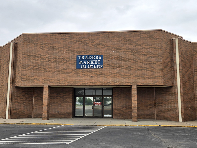 The unassuming brick exterior of Traders Market hides a treasure trove within, like finding a geode that's plain on the outside but crystalline magic inside.
