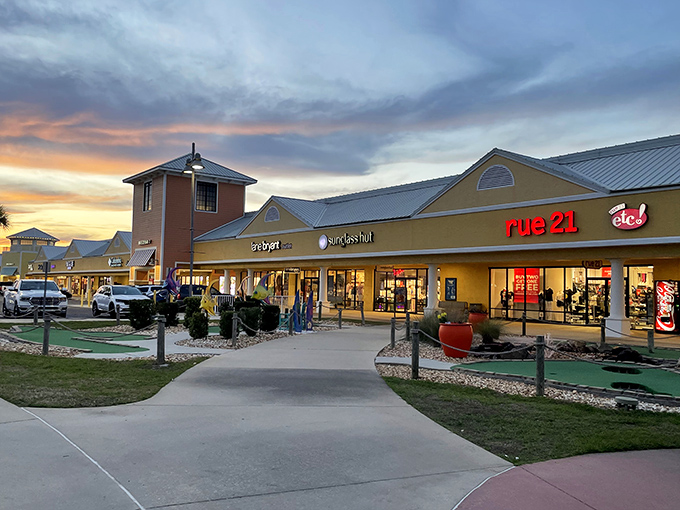 Sunset shopping at its finest! Tanger Outlets Foley's colorful storefronts glow with promise as dusk settles over this retail paradise near Alabama's Gulf Coast.