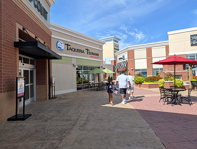 Outdoor dining at Taqueria Tsunami invites shoppers to refuel with Latin-Asian fusion under Georgia's blue skies &ndash; retail therapy meets actual therapy.