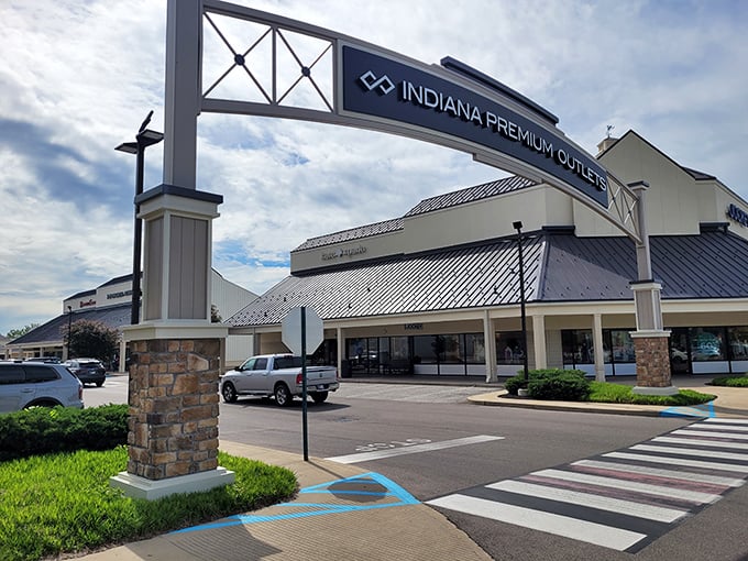 The welcoming archway at Indiana Premium Outlets beckons like a gateway to bargain paradise on I-65.