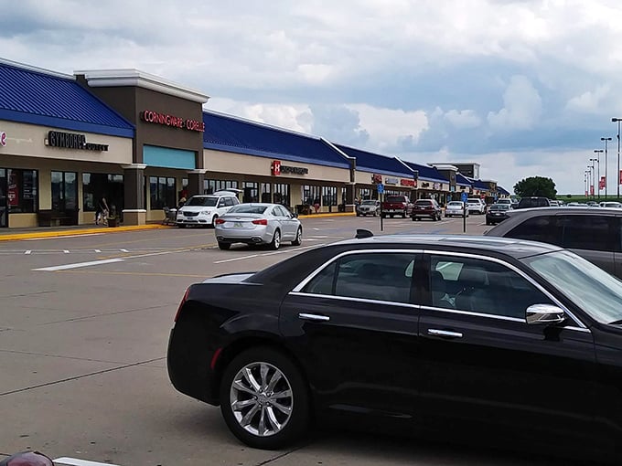 The grand entrance of Outlets Williamsburg rises like a modern monument to shopping, inviting visitors to uncover the treasures waiting inside.