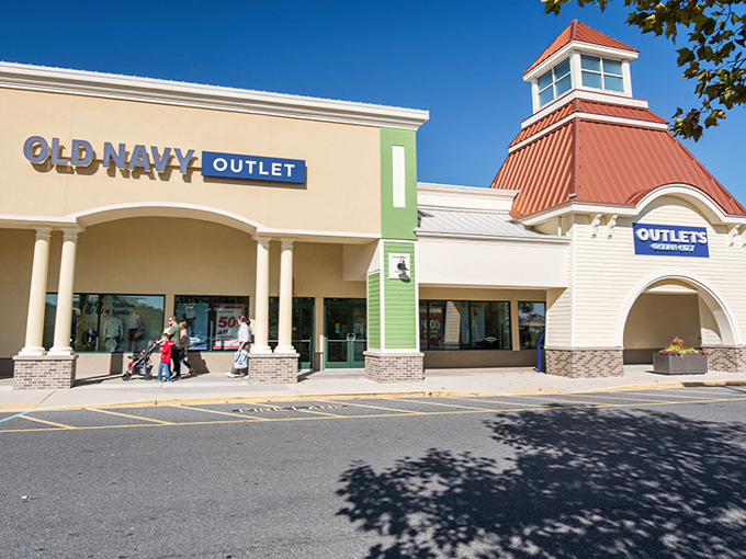 The coastal-inspired architecture of Outlets Ocean City welcomes shoppers with its distinctive red roofs and beachy vibe. Shopping paradise awaits!