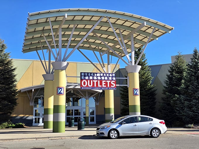 The iconic yellow-columned entrance stands like a retail Stonehenge, beckoning bargain hunters with its distinctive canopy that says "prepare your credit card for exercise."