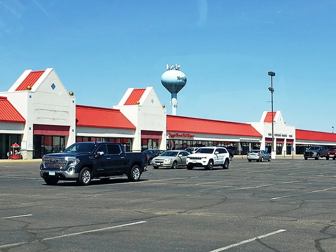 The iconic red roofs of North Branch Outlets stand like retail beacons against the Minnesota sky, promising treasures within for savvy shoppers.