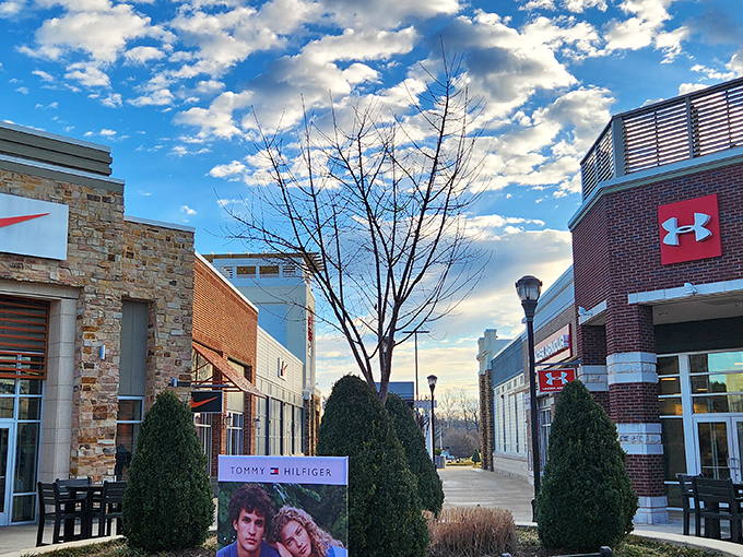Blue skies frame the architectural charm of Tanger Outlets, where Tommy Hilfiger and Under Armour beckon with promises of stylish savings.