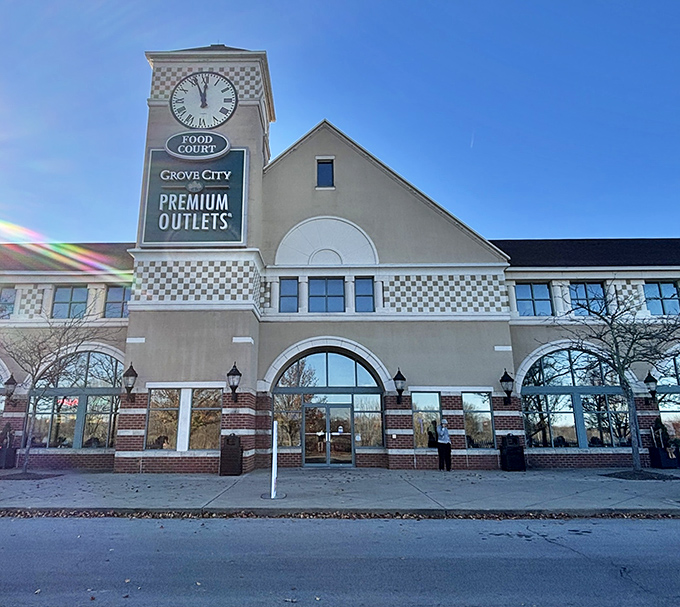 The iconic clock tower stands sentinel at Grove City Premium Outlets, promising treasures within and keeping shoppers mindful of how many hours they can hunt for bargains.