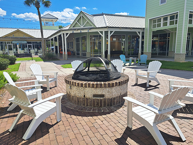 The coastal-inspired architecture of Tanger Outlets welcomes shoppers with Adirondack chairs around a fire pit—retail therapy with a side of relaxation.
