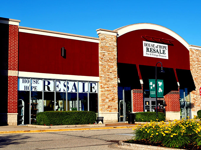 The distinctive burgundy facade and stone accents make House of Hope Resale impossible to miss. Bargain hunters' paradise disguised as an upscale boutique!