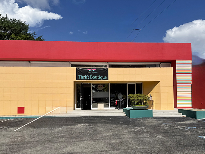 The sunshine-yellow exterior with bold red trim makes Dragonfly Thrift Boutique pop against the Florida sky like a tropical bird in flight.