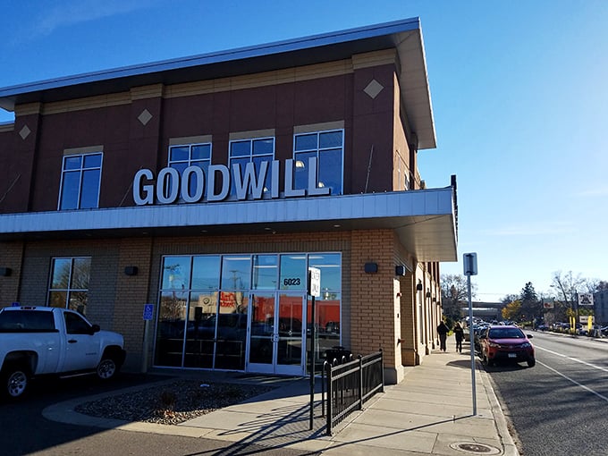 Under clear blue skies, this Goodwill outpost's clean lines and welcoming entrance promise treasures within for the patient explorer.
