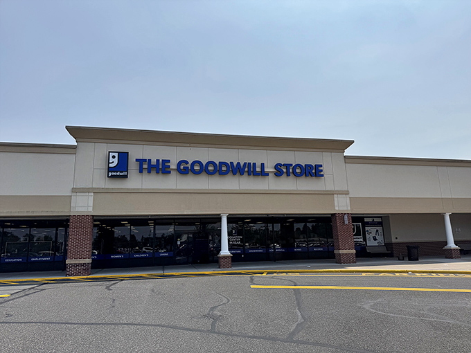 The iconic blue signage of Goodwill beckons like a siren song to bargain hunters. Treasure awaits inside!