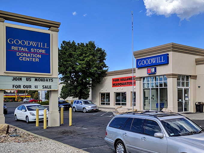 Against Utah's majestic mountains, this Goodwill Store stands like a temple of thrift, promising treasures within its unassuming beige walls.