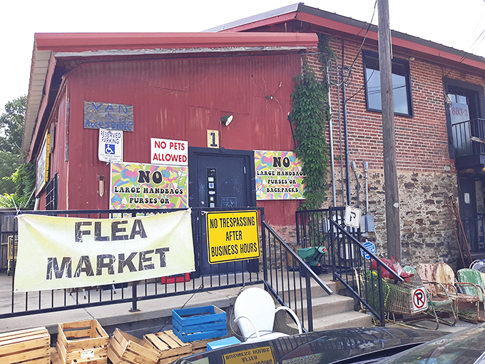 The unassuming exterior promises nothing, delivers everything. Like a poker player with four aces, this brick building keeps its treasures hidden behind that humble "FLEA MARKET" banner.