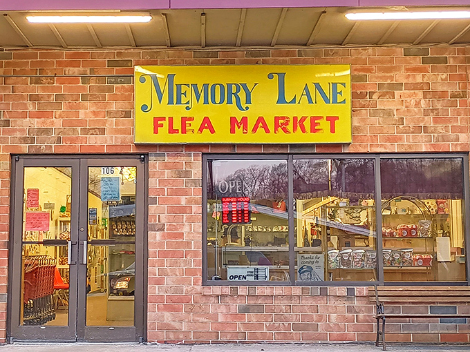 The bright yellow sign of Memory Lane Flea Market beckons like a treasure map's X-marks-the-spot, promising adventures in nostalgia behind those glass doors.