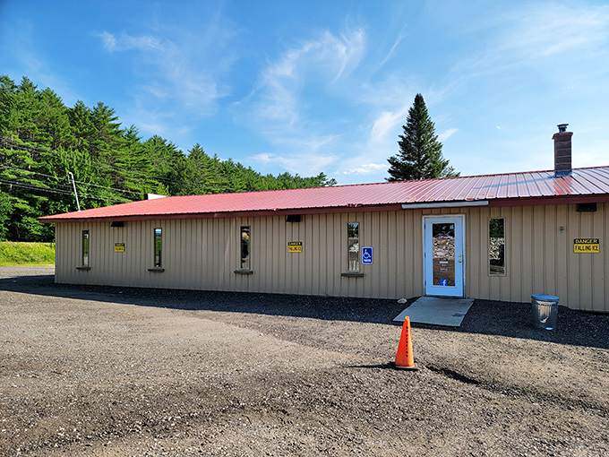 The unassuming exterior of The Willows Flea Market stands like a treasure chest waiting to be opened, its tan walls and red roof hiding countless wonders within.