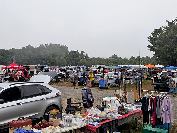 Treasure hunting in full swing! A vendor&rsquo;s table is piled high with vintage clothes and countless other finds as shoppers explore the grounds like archaeologists uncovering hidden gems.