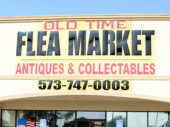The unmistakable yellow and red signage of Old Time Flea Market beckons treasure hunters like a lighthouse for bargain-loving ships at sea.