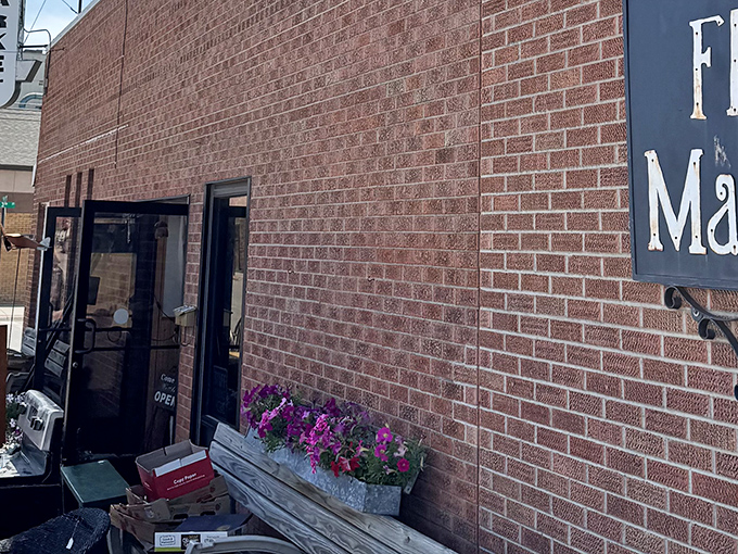 The unassuming brick exterior of Junktion Flea Market hides a universe of treasures behind those modest doors.