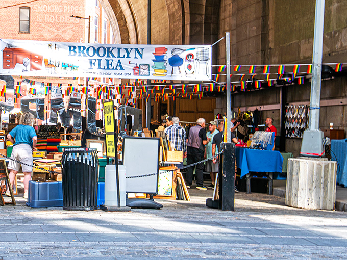 The iconic Brooklyn Flea entrance welcomes treasure hunters under the historic archway, where bargain quests and unexpected discoveries await.