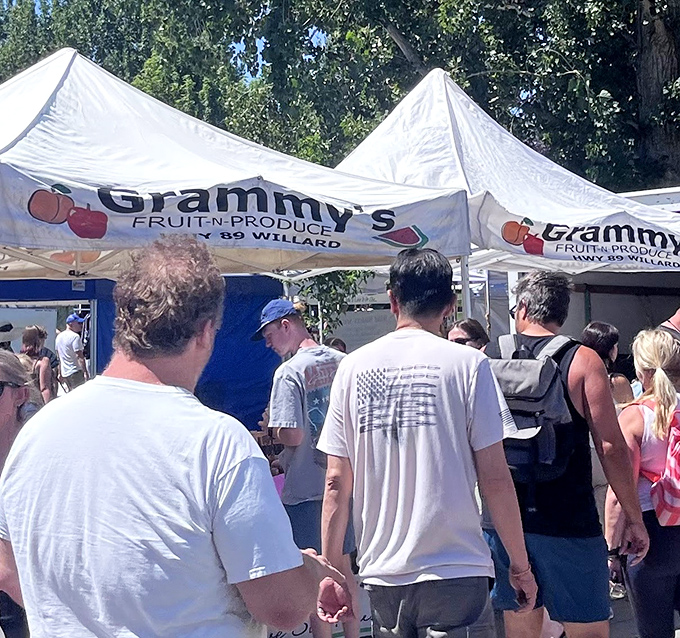 White tents stretch toward the horizon like a village of culinary explorers, each one harboring treasures that make grocery stores seem like sad, fluorescent caves.