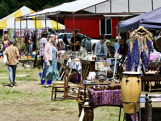 Treasure hunters navigate the colorful maze of tents and tables, where Vermont's largest outdoor bazaar transforms an ordinary field into a bargain paradise every Sunday.