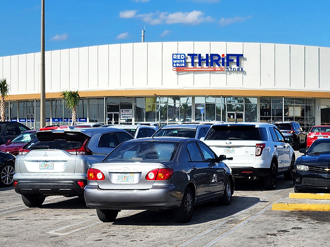 The iconic white curved facade of Red White & Blue Thrift Store stands like a retail promised land where bargain hunters' dreams come true.