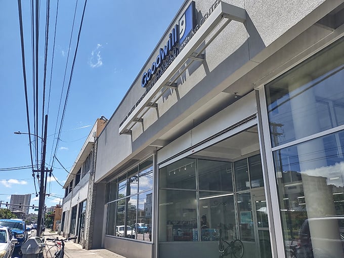The Goodwill storefront stands proudly against Honolulu's blue sky, a beacon for treasure hunters and bargain enthusiasts alike.