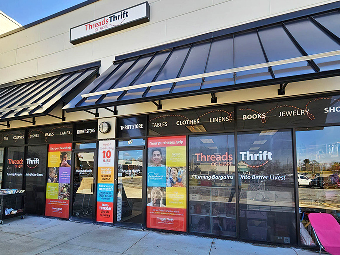 The unassuming storefront of Threads of Hope hides a treasure trove within, like finding a secret passage to bargain paradise.