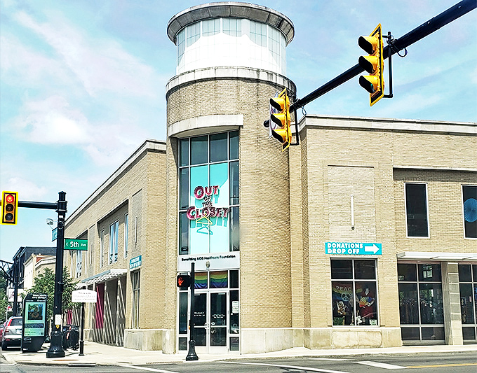 The iconic cylindrical tower entrance of Out of the Closet stands like a beacon of hope and bargains on the corner of High Street and 5th Avenue.