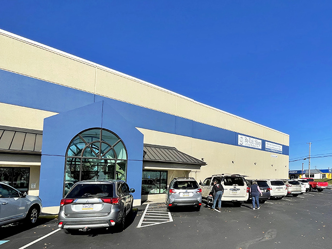 A busy day at bargain paradise&mdash;the blue and cream facade welcomes shoppers ready to fill carts without emptying wallets.