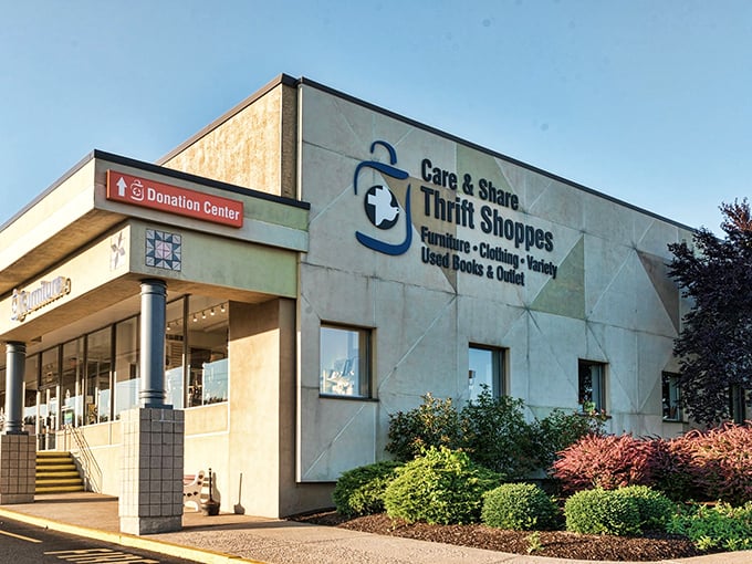 The vibrant landscaping outside Care & Share practically shouts "treasure hunting paradise ahead" before you even step inside.