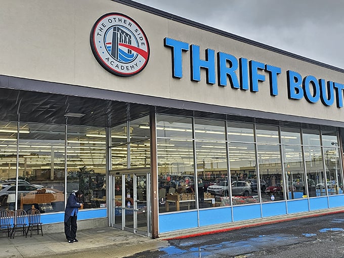 The iconic blue signage of The Other Side Thrift Boutique beckons bargain hunters with promises of hidden treasures inside.