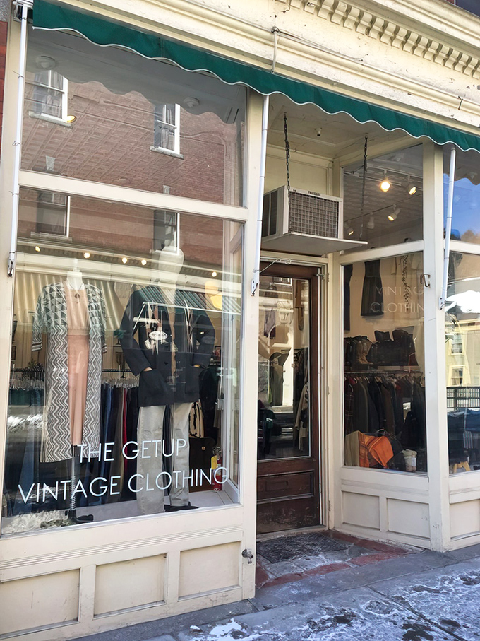 The charming storefront of The Getup Vintage beckons with its classic green awning and carefully curated window displays. Fashion time travel begins here!