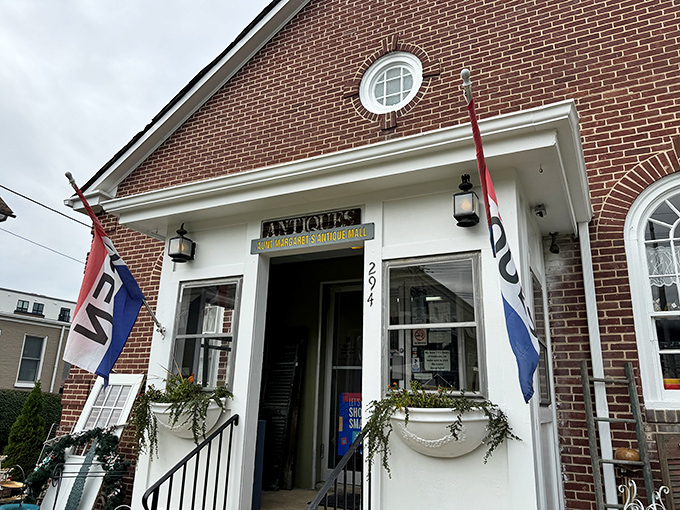 The brick facade of Aunt Margaret's beckons like a time portal disguised as a charming storefront. Those flags aren't just decoration&mdash;they're waving you toward vintage treasure.