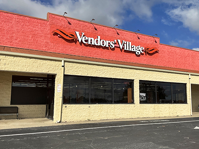 The bright red facade of Vendors' Village stands out like a beacon of vintage treasures, promising adventures in nostalgia just beyond those doors.
