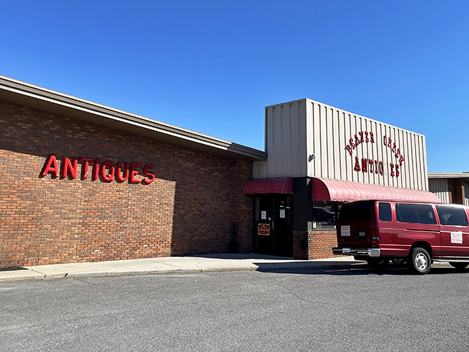 The iconic red lettering against cream-colored siding promises treasures within. That white bench isn't just decorative&mdash;it's for when your shopping companions need a breather!