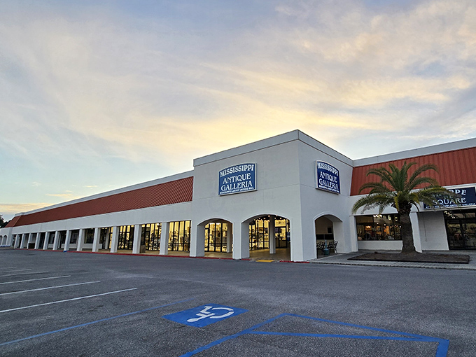Sunset casts a golden glow on Mississippi's largest antique mall. The building may say "shopping center," but inside it's more "museum where you can touch everything."