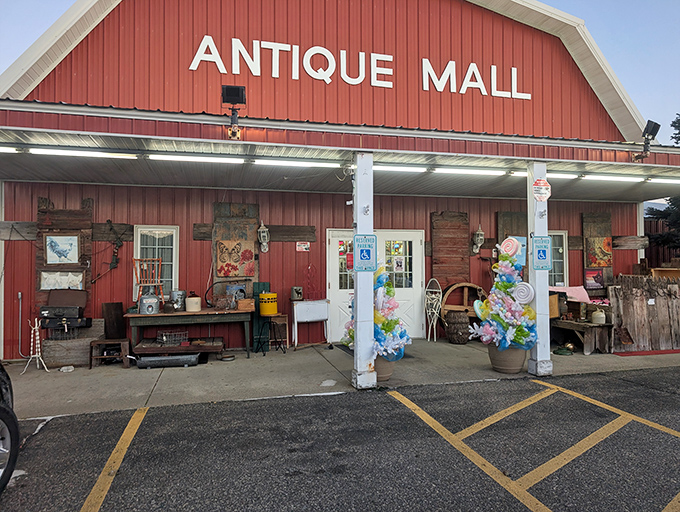 The iconic red barn exterior of Wisconsin Dells Antique Mall beckons treasure hunters like a siren call to sailors of nostalgia.