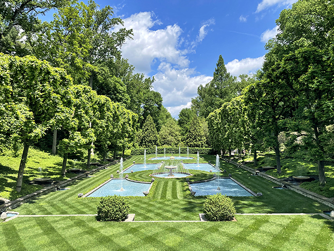 The Italian Water Garden unfolds like a geometric dream, with blue-tiled pools and dancing fountains creating Pennsylvania's most perfect slice of Renaissance Italy.