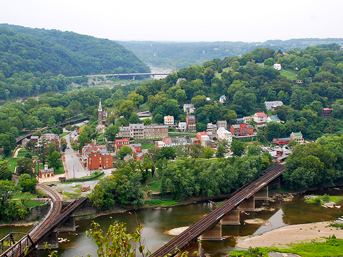Nestled against emerald mountains, Harpers Ferry's colorful historic buildings create a scene so picturesque you'll swear someone painted it just for your arrival.