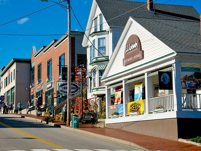 Classic storefronts meet autumn foliage in a combination that makes your camera roll very, very happy indeed.