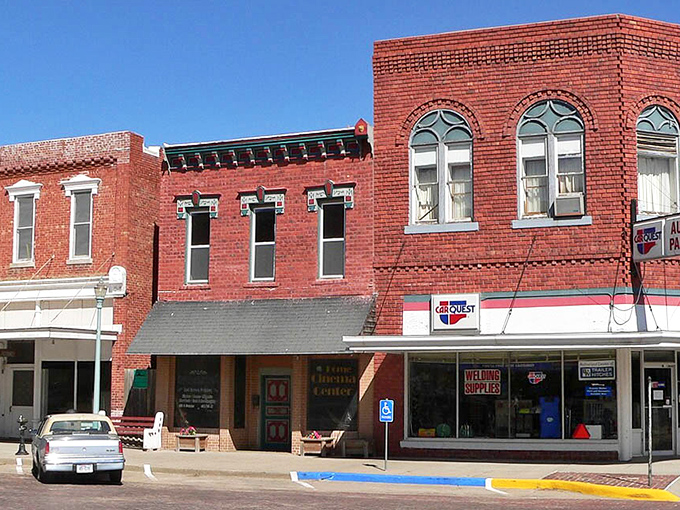 Historic brick buildings stand sentinel along Red Cloud's main street, their weathered facades telling stories of prairie prosperity and small-town resilience.