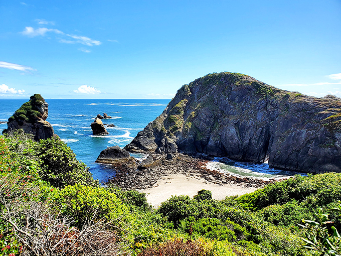 The perfect Oregon coast postcard moment &ndash; deep blue waters meeting golden sands, with sea stacks playing the role of nature's sculptures.