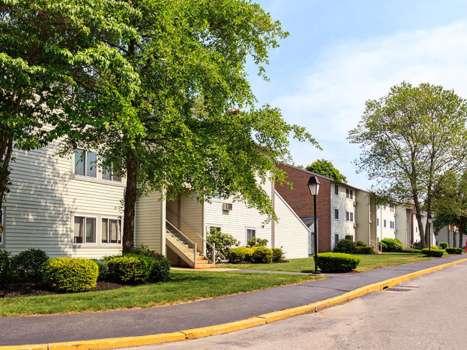Residential charm meets practical living in West Warwick's apartment communities, where well-maintained landscaping creates a welcoming neighborhood vibe.