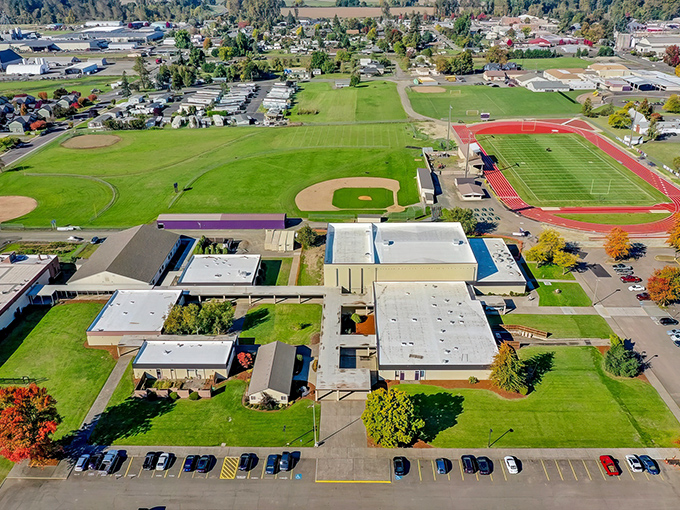 Aerial view of Harrisburg showcases its perfect blend of small-town charm and modern amenities. Those baseball fields aren't just for show&mdash;they're community gathering spots.