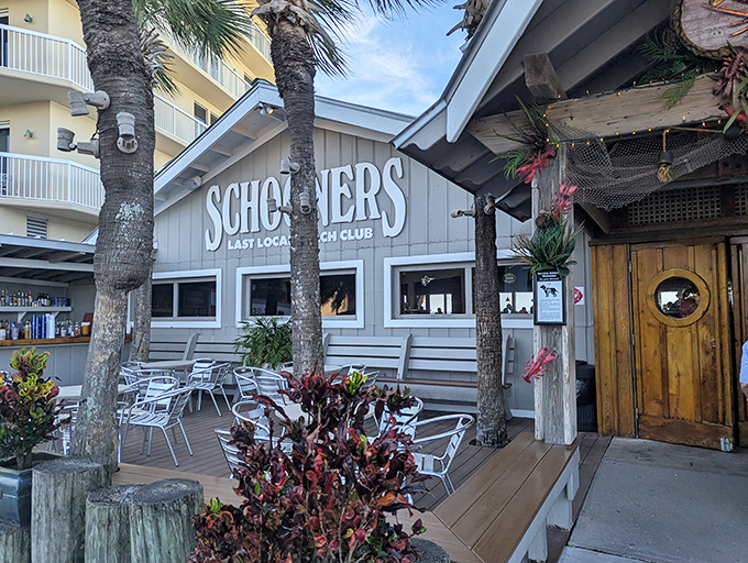 Schooners' weathered wooden exterior isn't trying to impress anyone, which is precisely why it's so impressive. Florida beach perfection without the pretense.