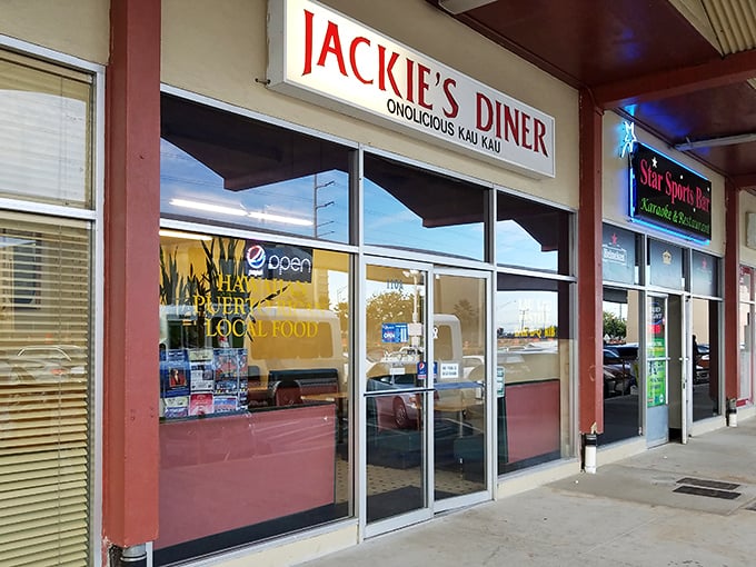 Strip mall treasure hunting at its finest. Jackie's neon sign beckons like a lighthouse for hungry souls navigating the sea of chain restaurants.